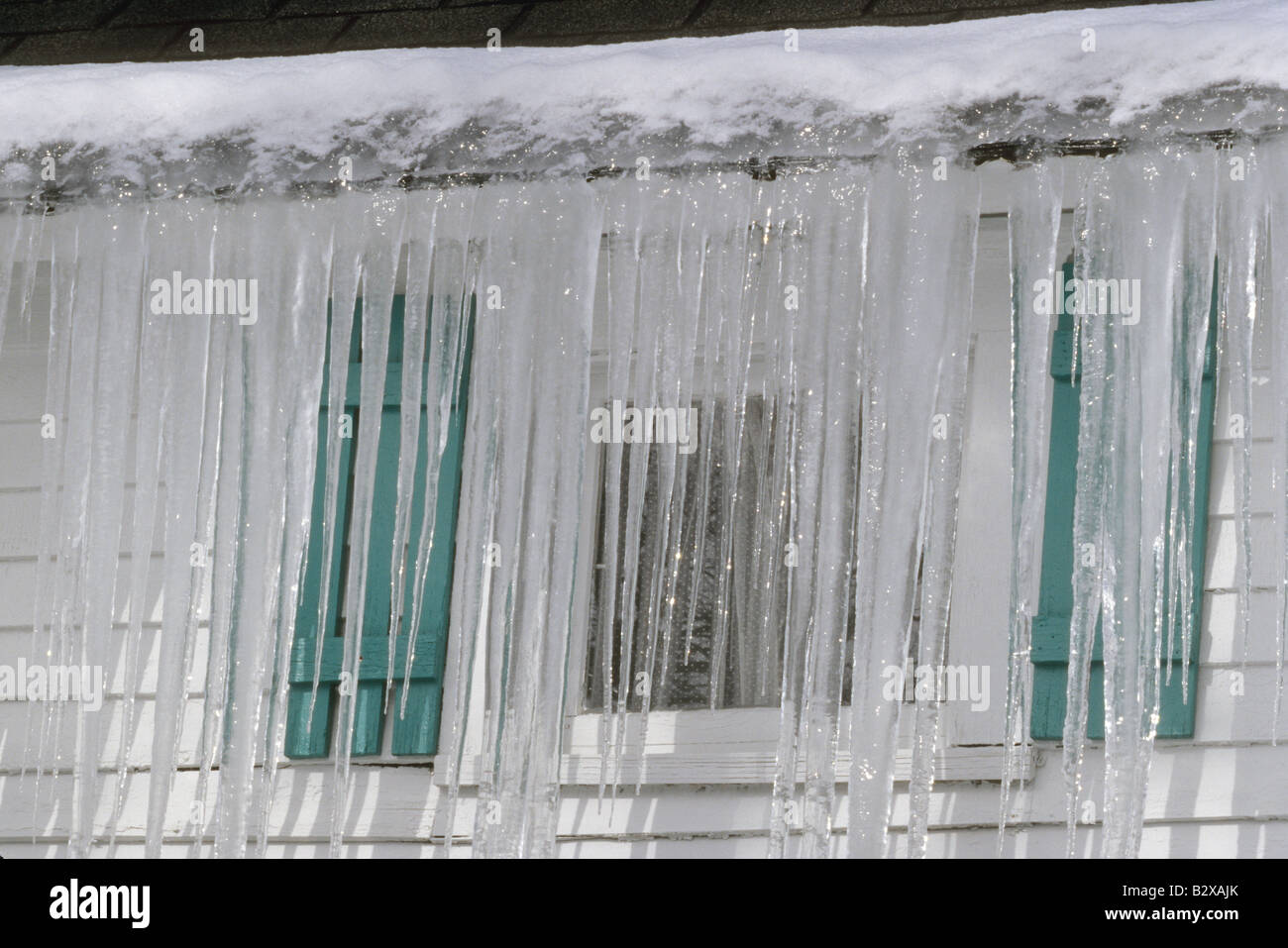 Icicles formed at drip edge of roof Stock Photo - Alamy