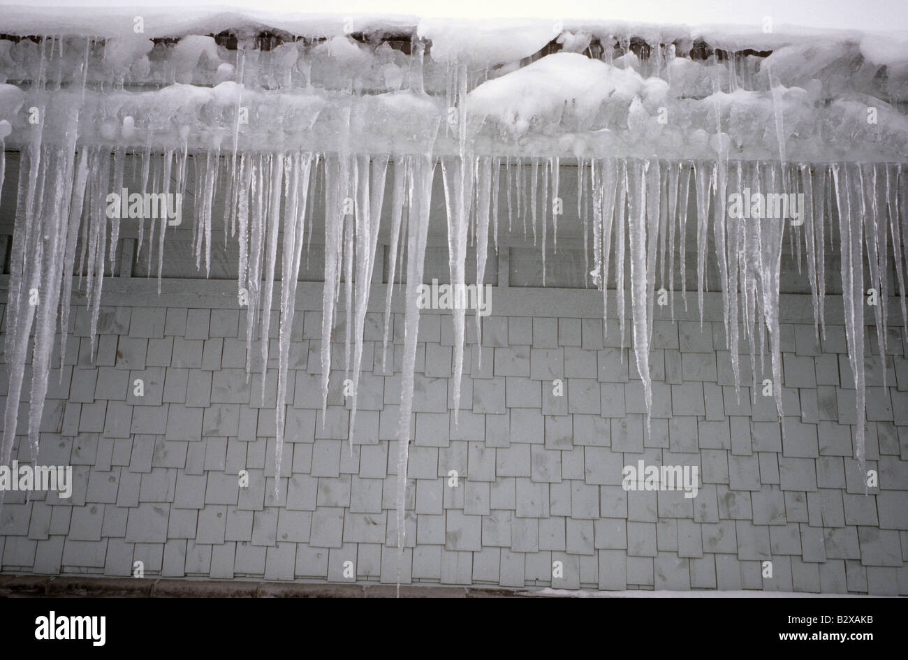 Icicles formed at drip edge of roof Stock Photo - Alamy