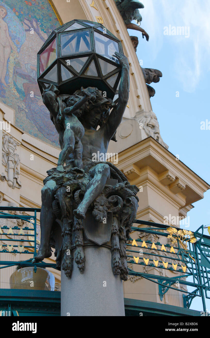 The statue of a man and a child holding a polygon glass ball on the ...