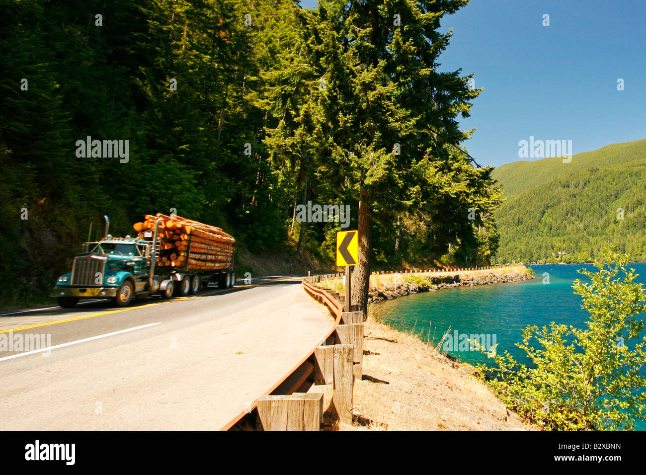 Logging truck on Highway 101 along Lake Crescent, Olympic National Park ...