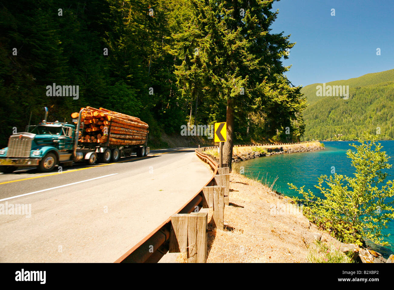 Logging truck on Highway 101 along Lake Crescent, Olympic National Park ...