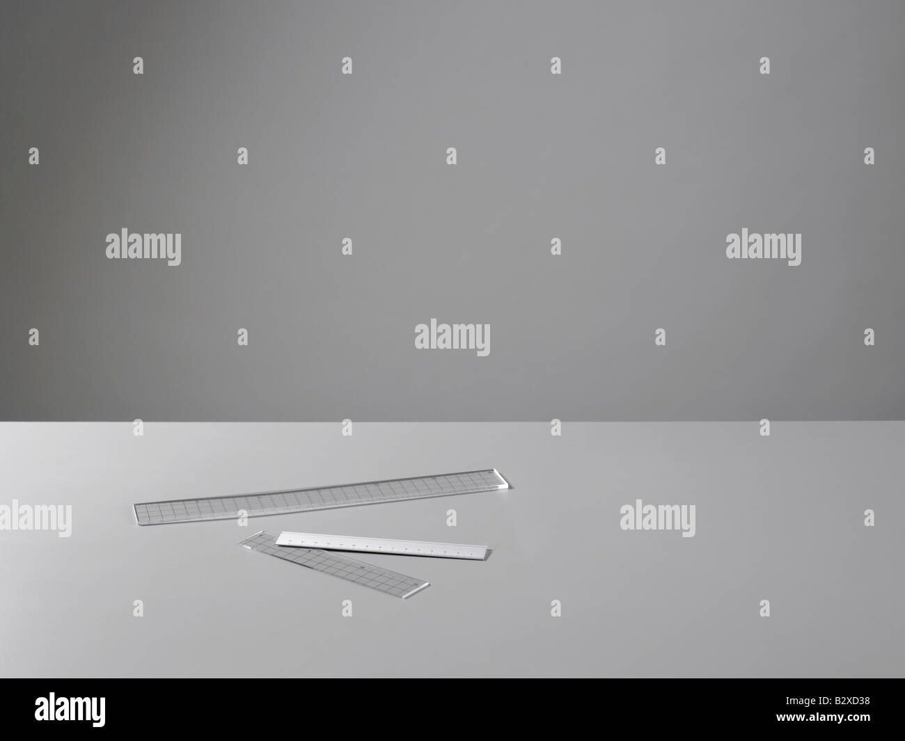 rulers on grey background Stock Photo - Alamy