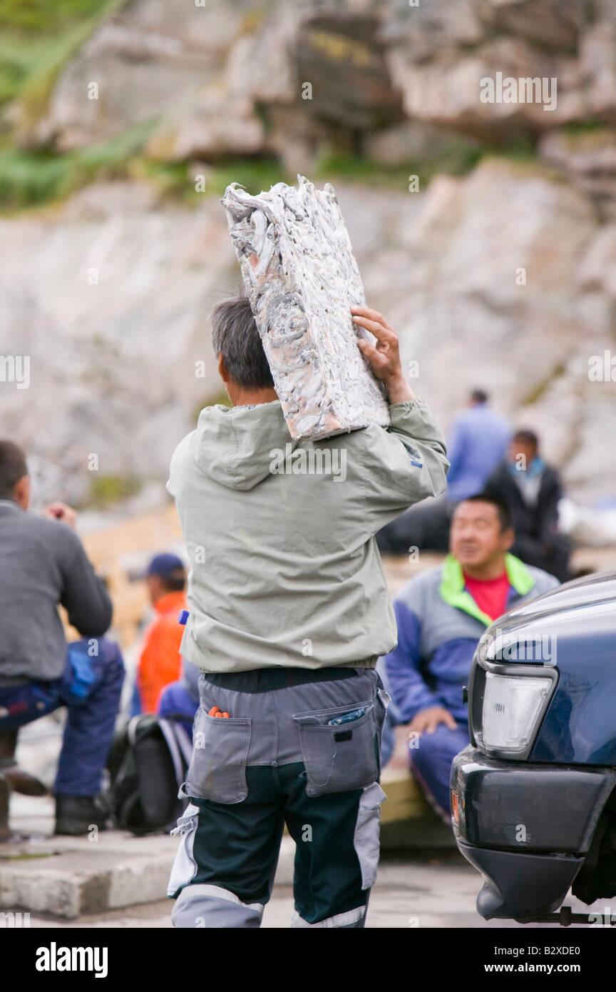 Inuit man carrying frozen fish hi-res stock photography and images - Alamy