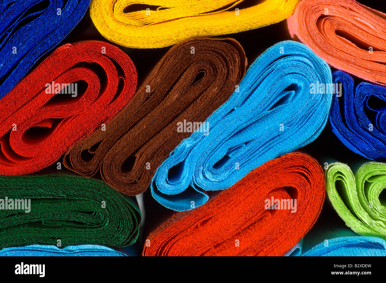 Paper tubes of different colours in the store Stock Photo - Alamy