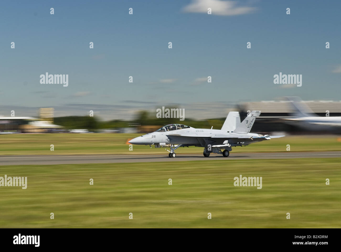 An FA-18 fighter jet takes off at the Farnborough Airshow in England ...