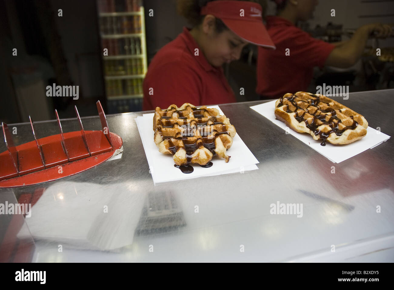Belgian waffles with chocolate sauce sold from a stall in Brussels ...
