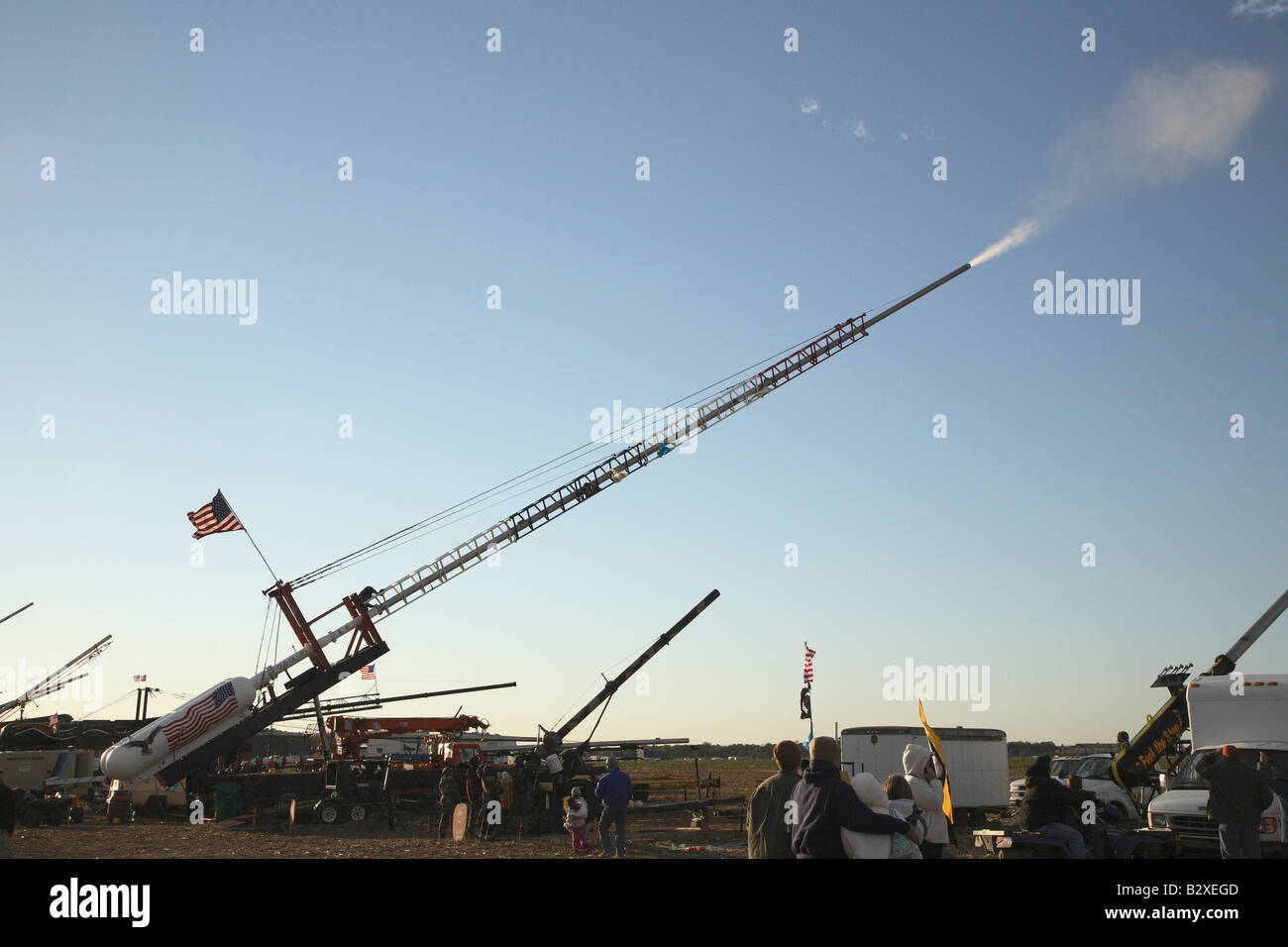 Long barreled derrick mounted air cannon from side, raised with ‘smoke ...
