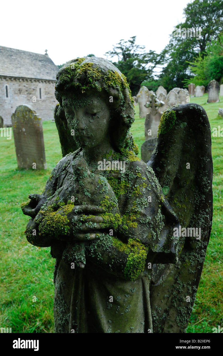 Stone angel in cemetery of St Nicholas Church, Studland, Dorset ...