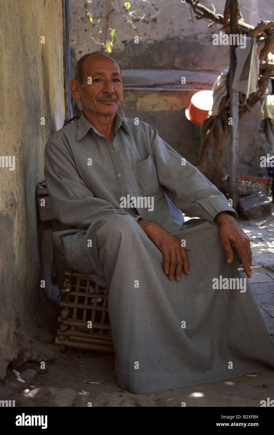 A local man wearing traditional dress poses for the camera in the ...