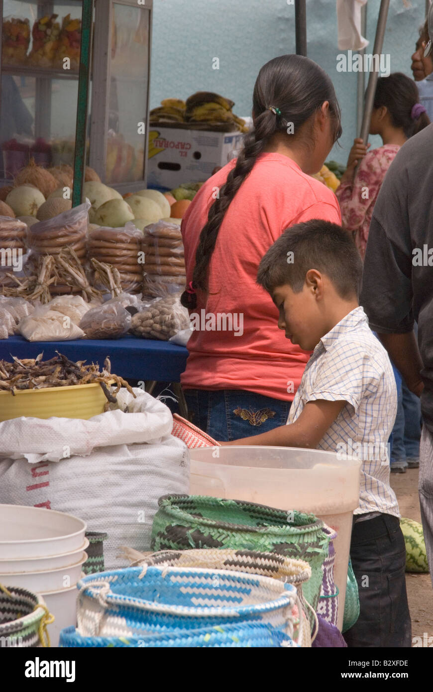 merchants and shoppers at a roadside flea market south of Ensenada ...