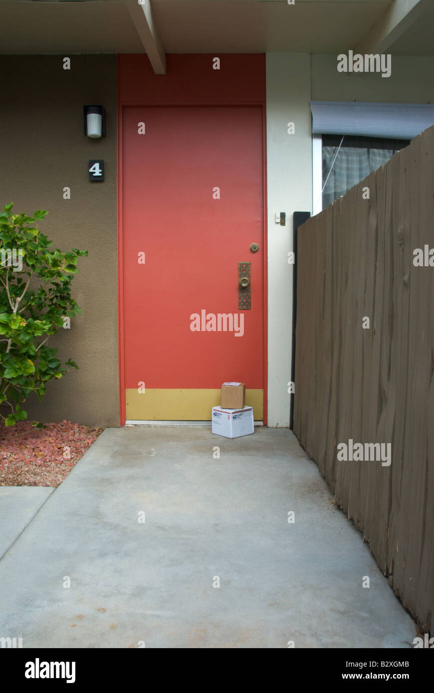 Parcels left at front door Stock Photo - Alamy