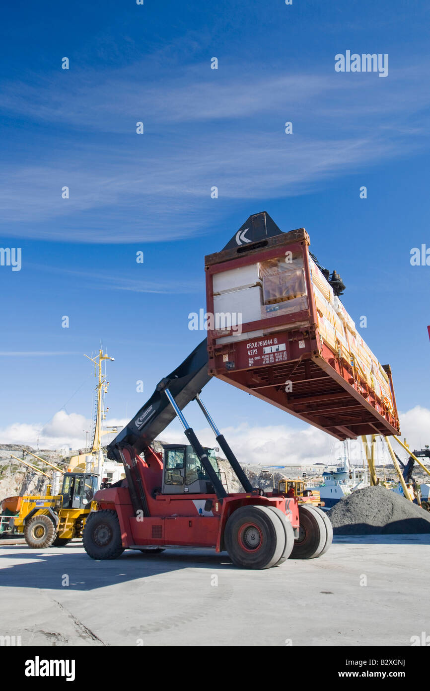 Moving freight containers around at Ilulissat dock on Greenland Stock ...