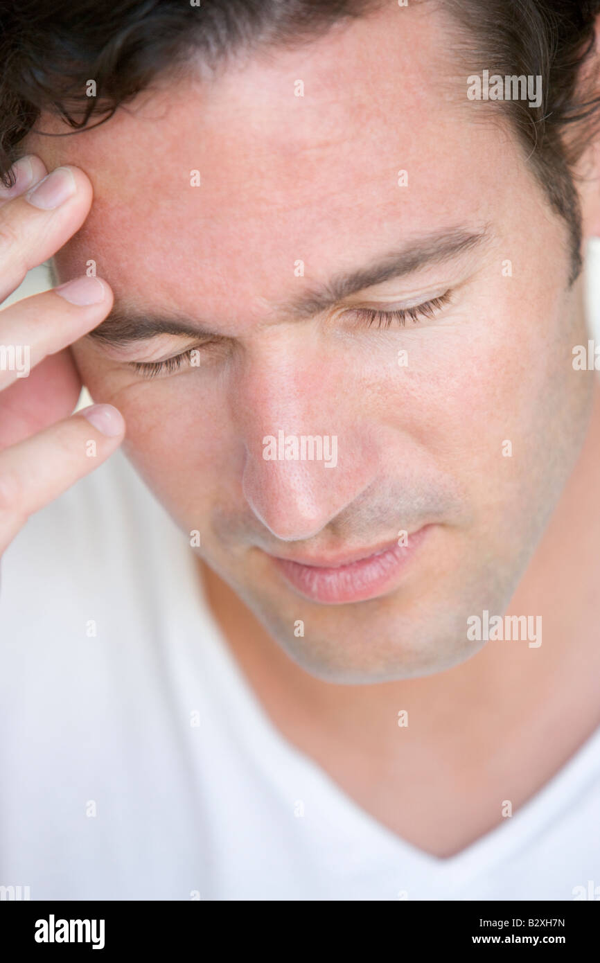 Head shot of man scowling Stock Photo - Alamy