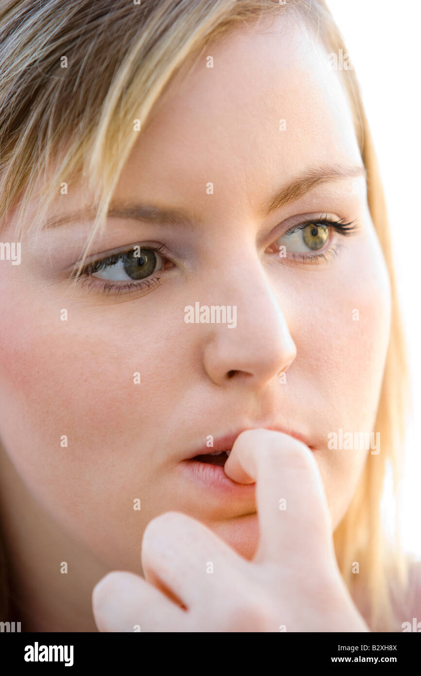 Head shot of worried woman Stock Photo - Alamy
