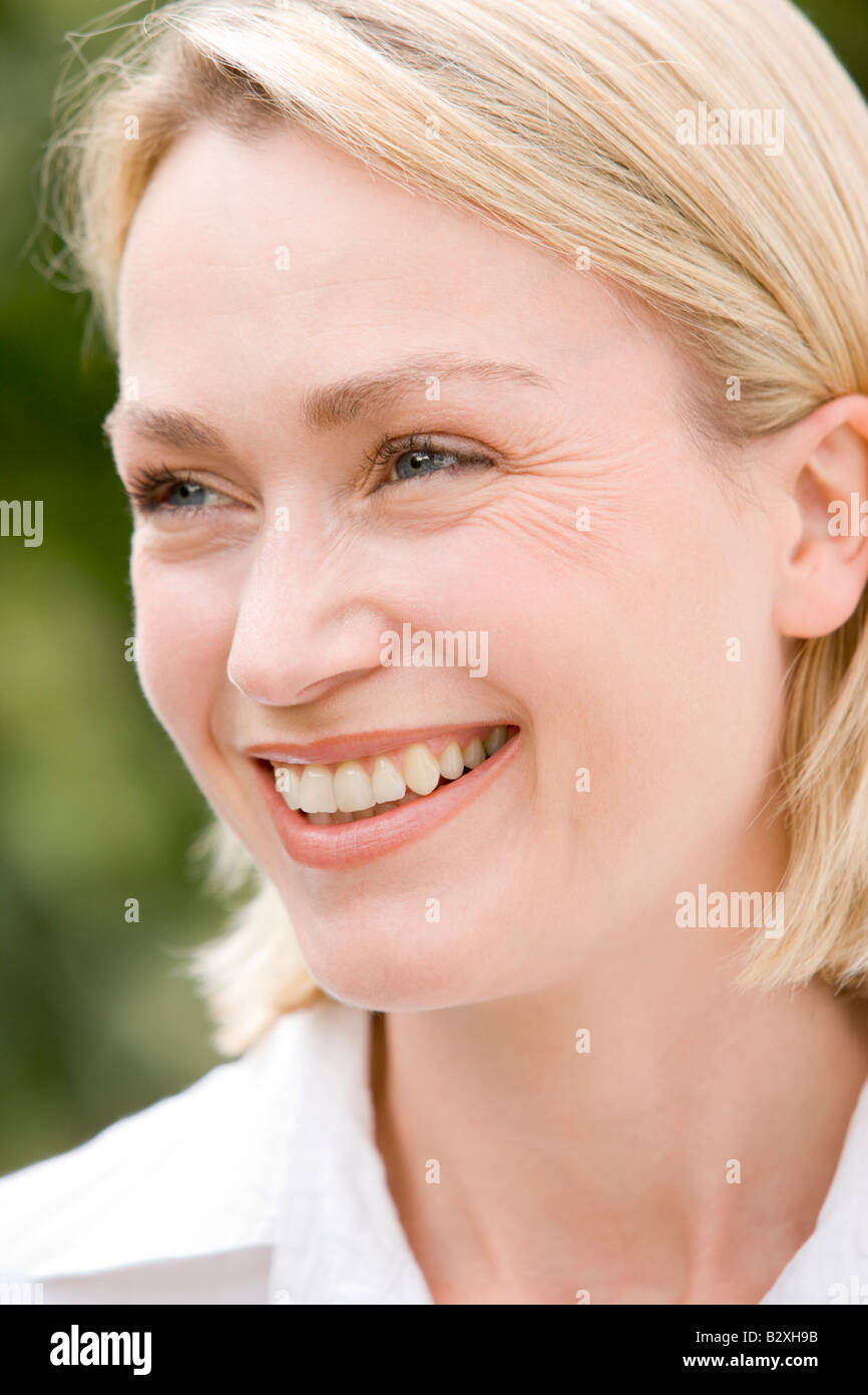 Head shot of woman smiling Stock Photo - Alamy