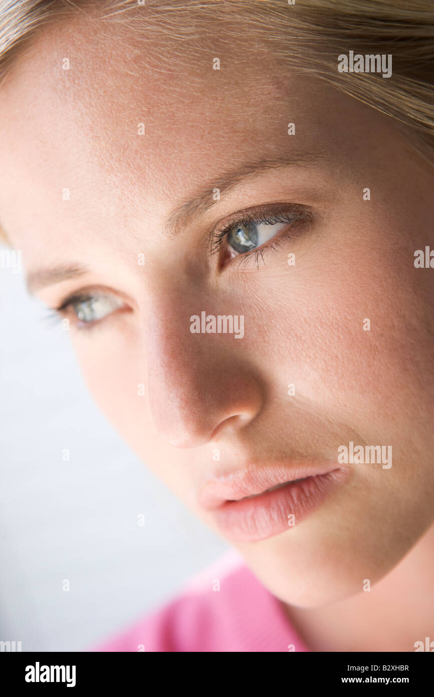 Head shot of woman thinking Stock Photo - Alamy