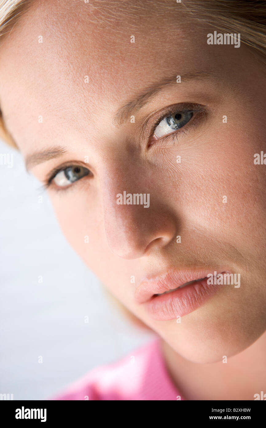 Head shot of woman thinking Stock Photo - Alamy