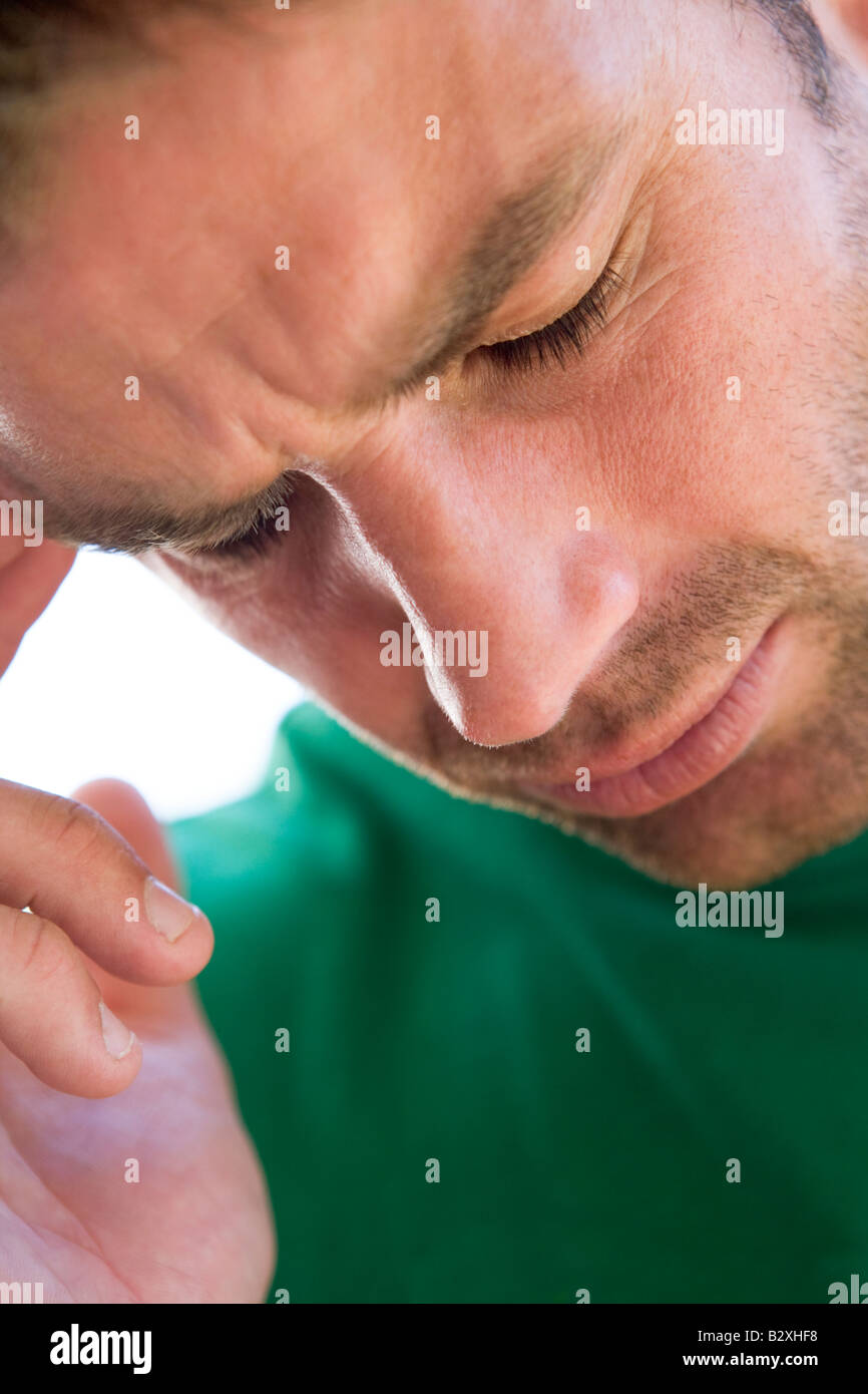 Head shot of man scowling Stock Photo - Alamy