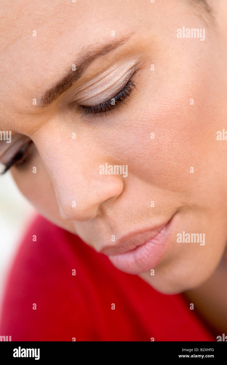 Head shot of woman scowling Stock Photo - Alamy