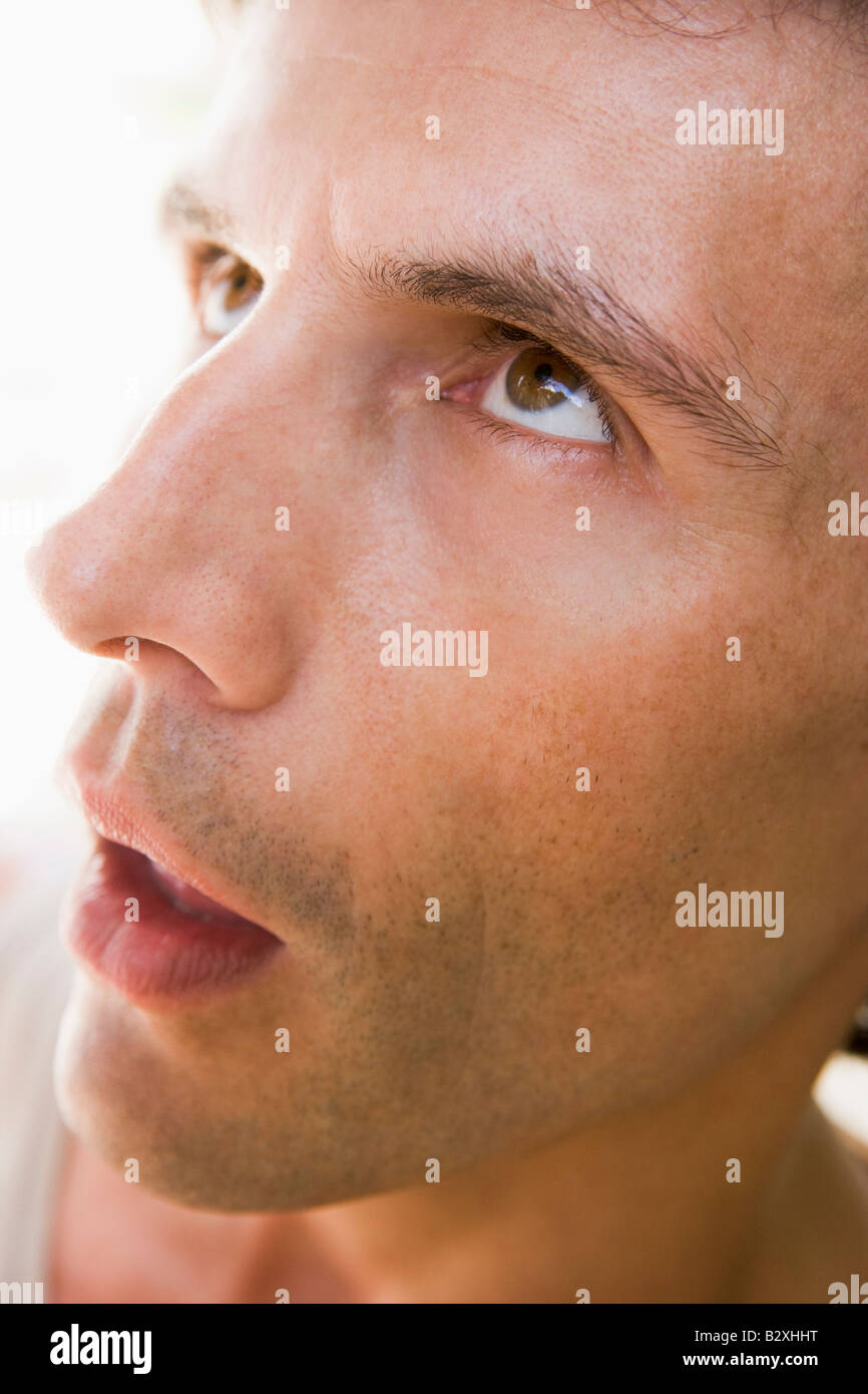 Head shot of man thinking Stock Photo - Alamy