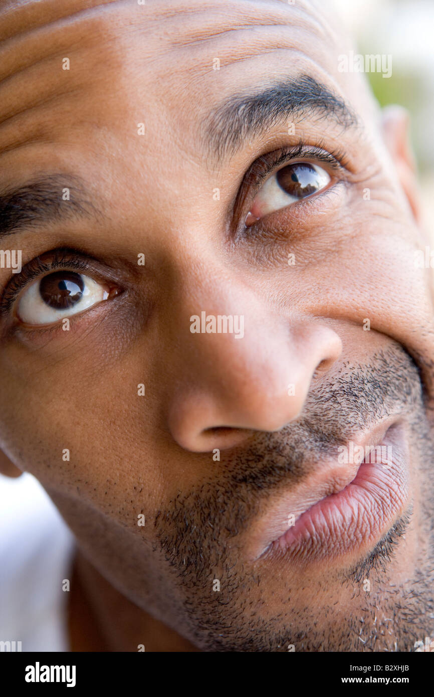 Head shot of man thinking Stock Photo - Alamy