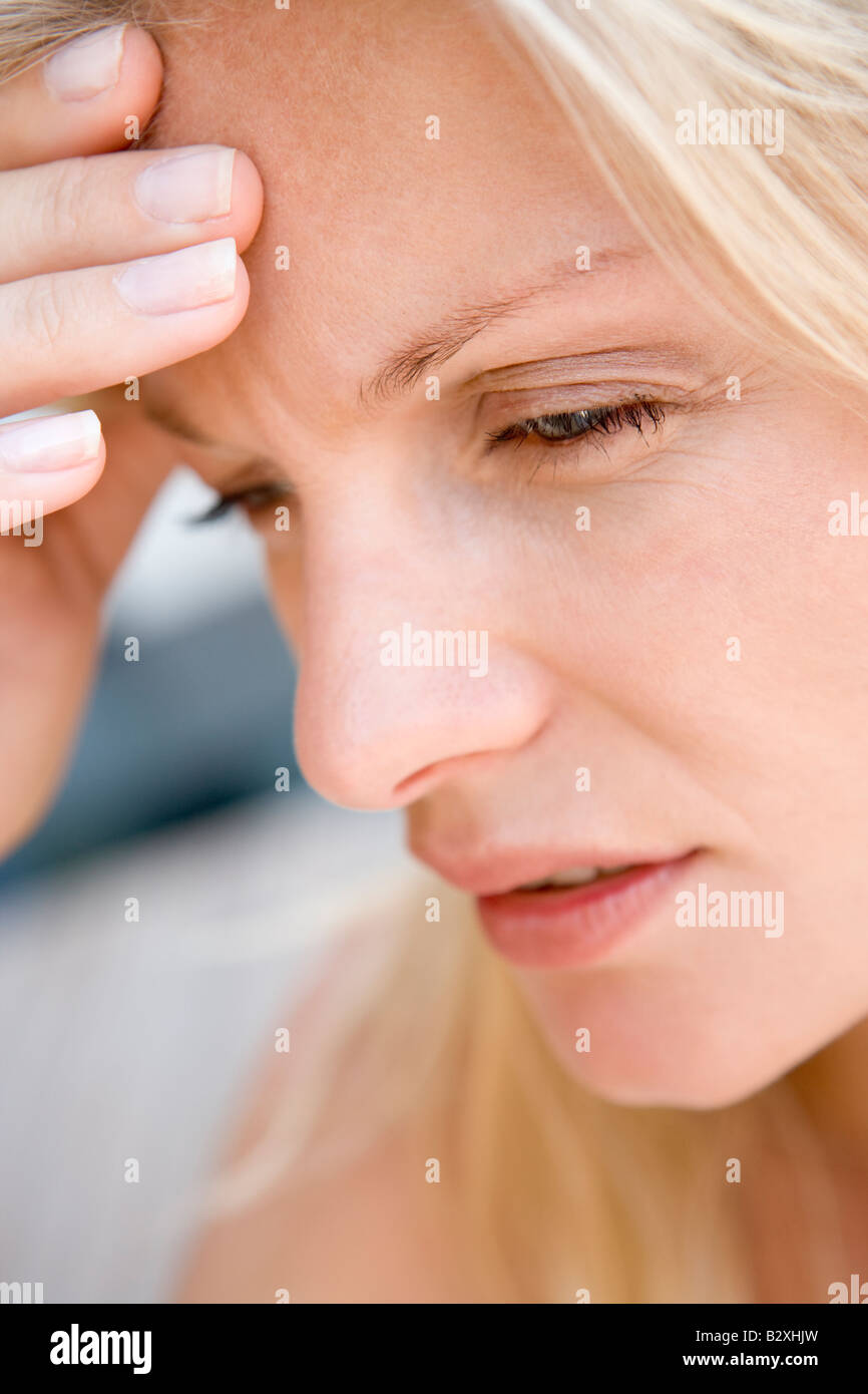 Head shot of woman scowling Stock Photo - Alamy