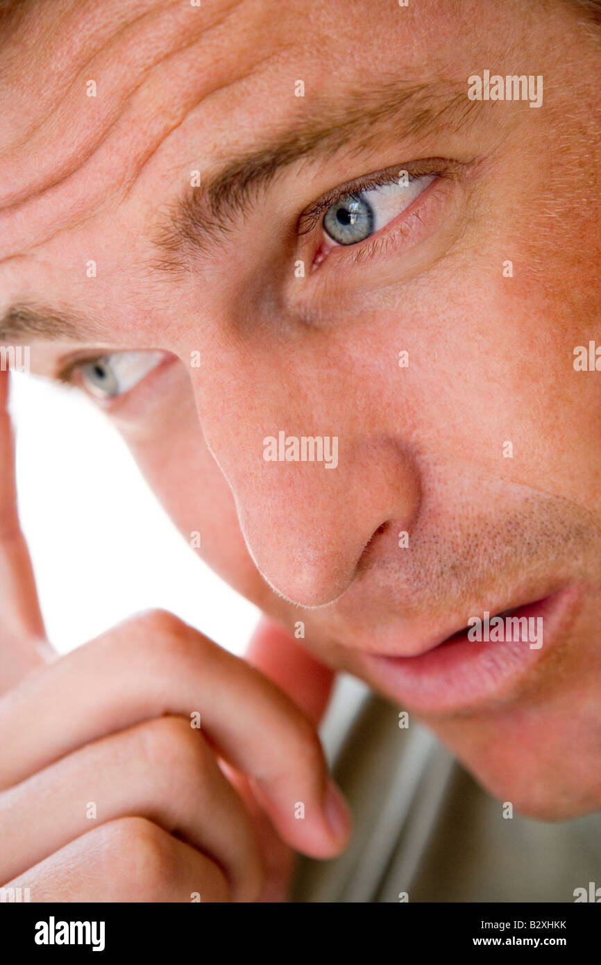 Head shot of man thinking Stock Photo - Alamy