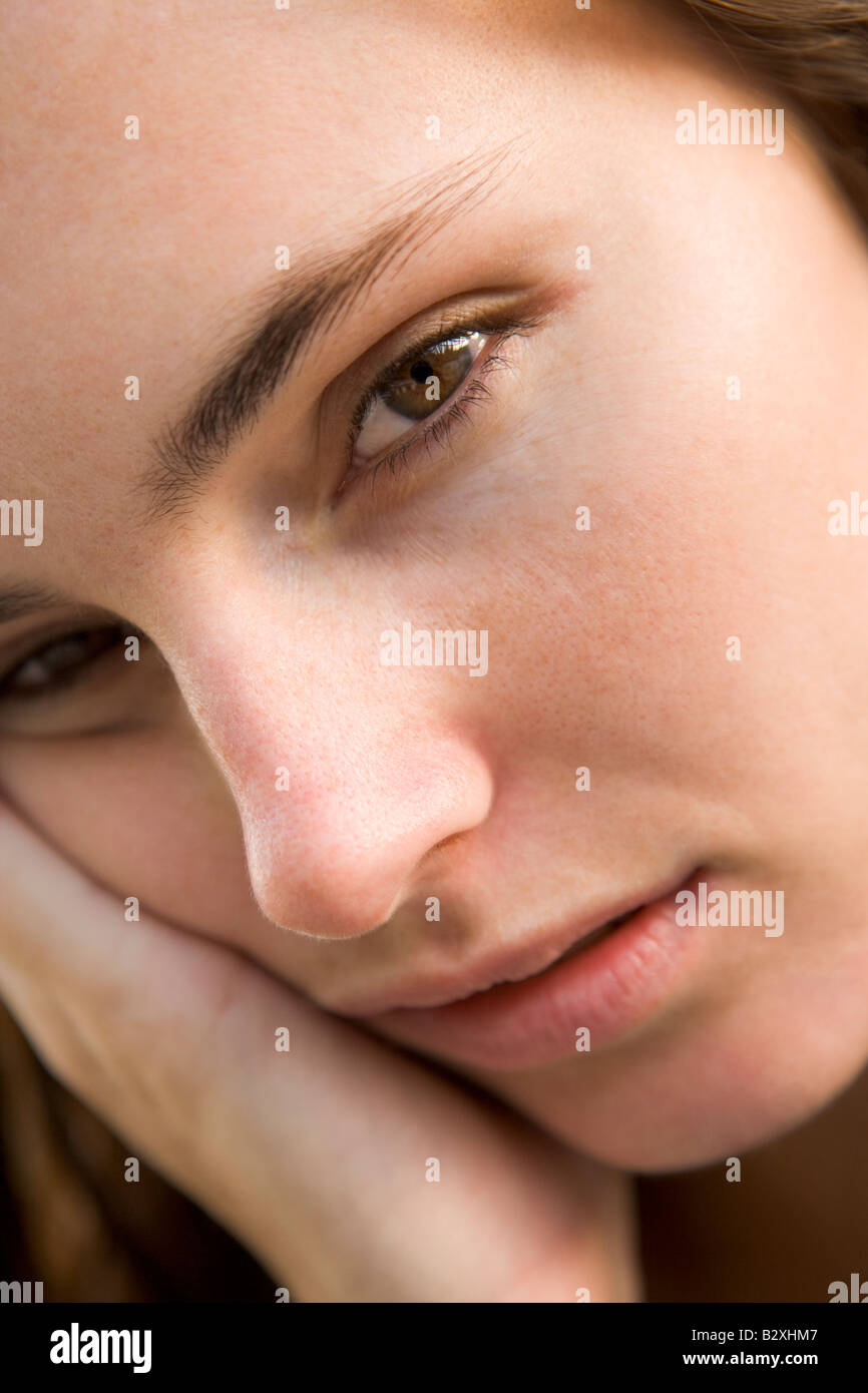 Head shot of woman thinking Stock Photo - Alamy