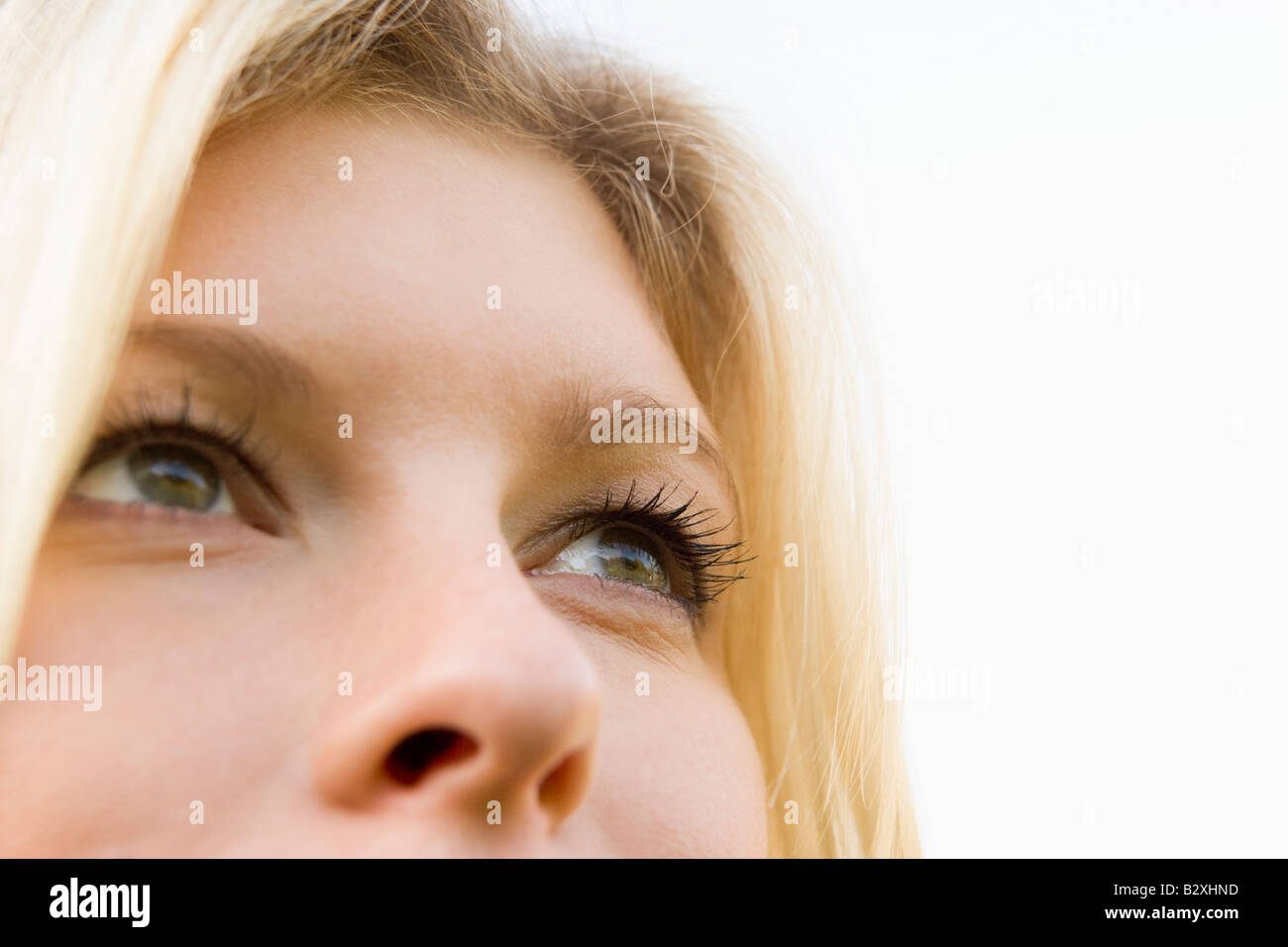 Head shot of woman thinking Stock Photo - Alamy