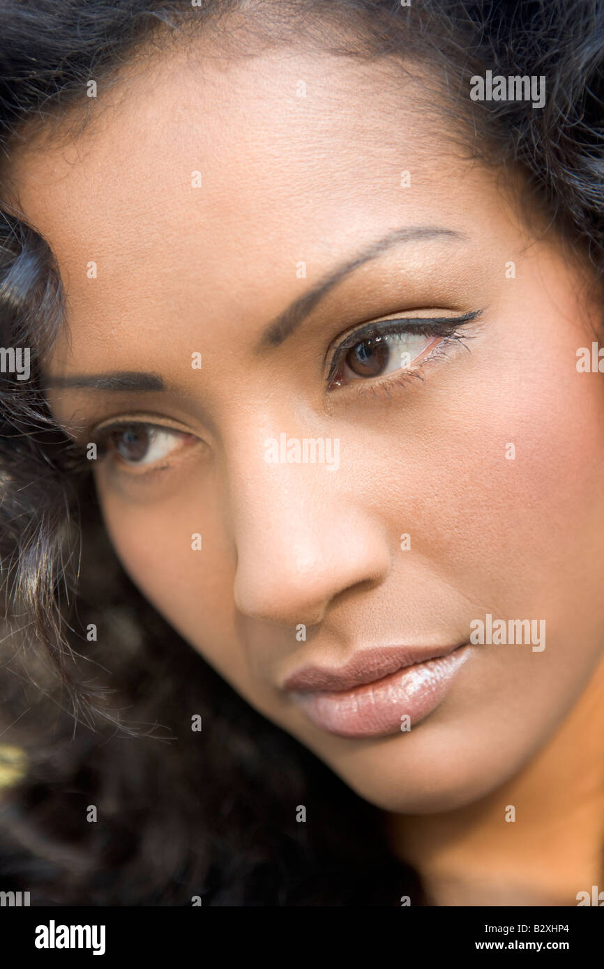 Head shot of woman thinking Stock Photo - Alamy