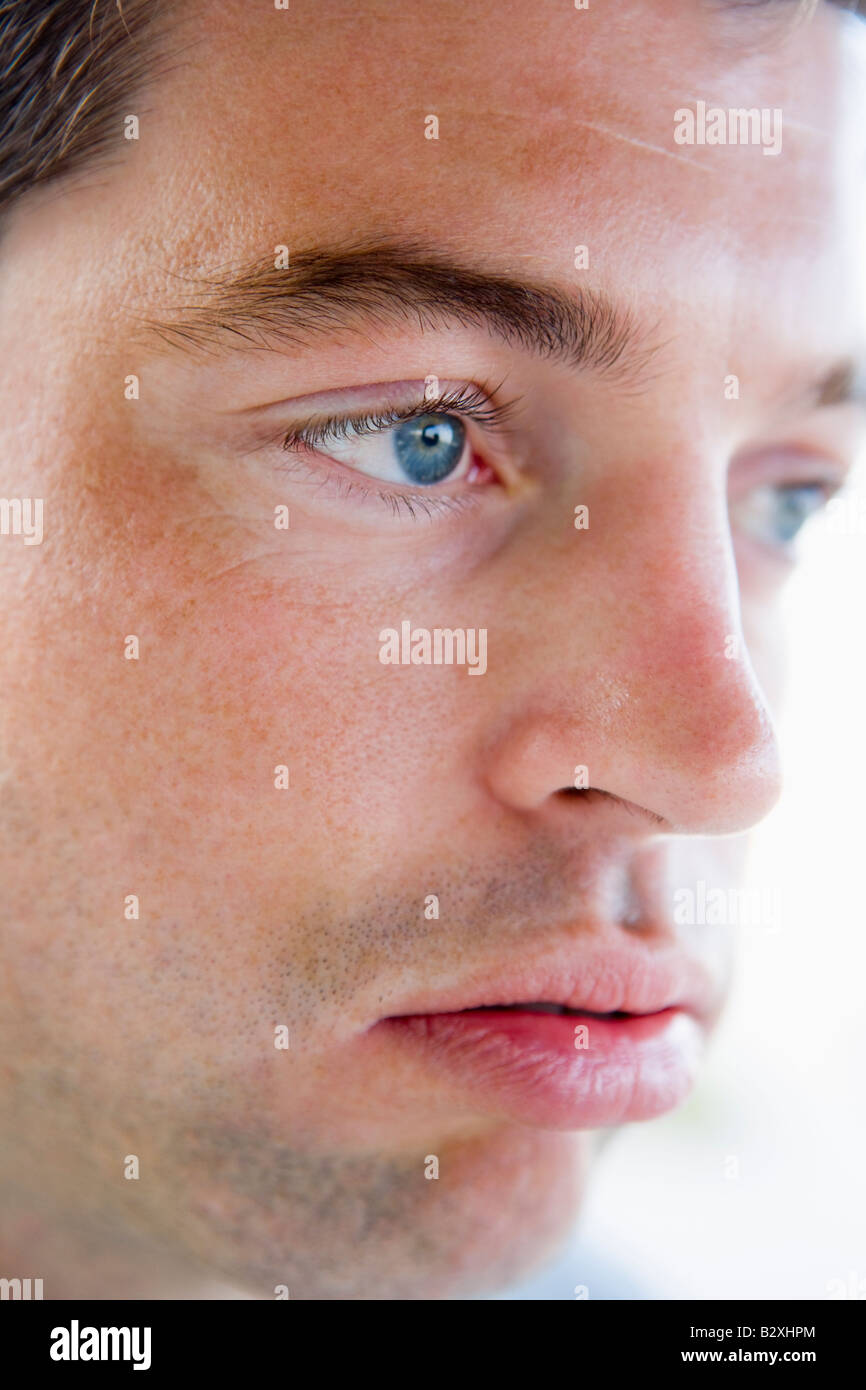 Head shot of man thinking Stock Photo - Alamy