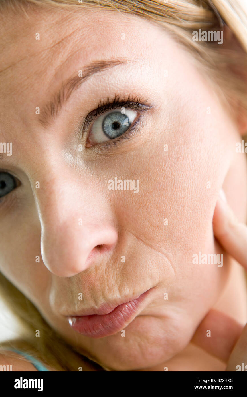 Head shot of woman thinking Stock Photo - Alamy