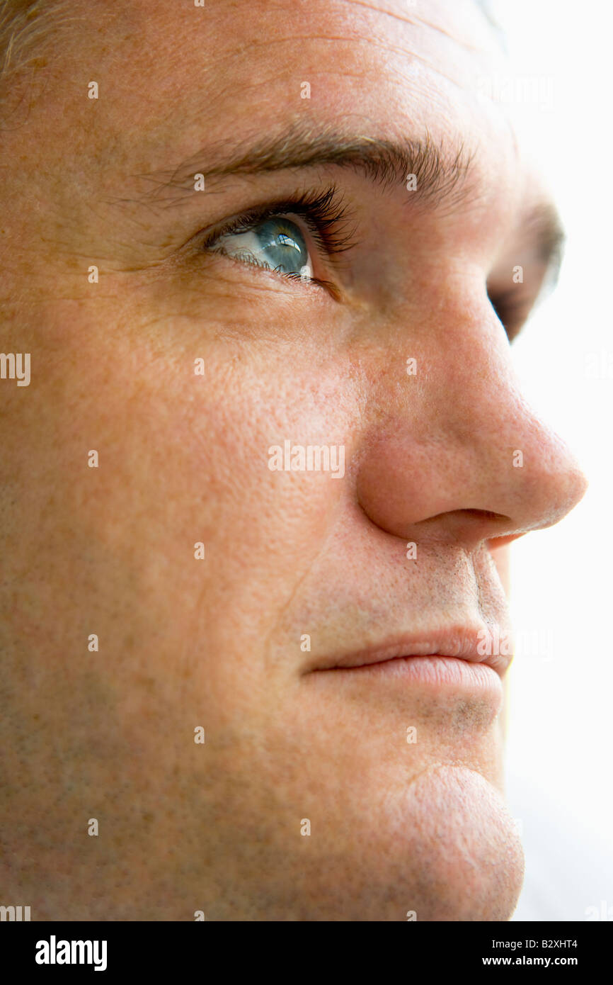 Head shot of man thinking Stock Photo - Alamy
