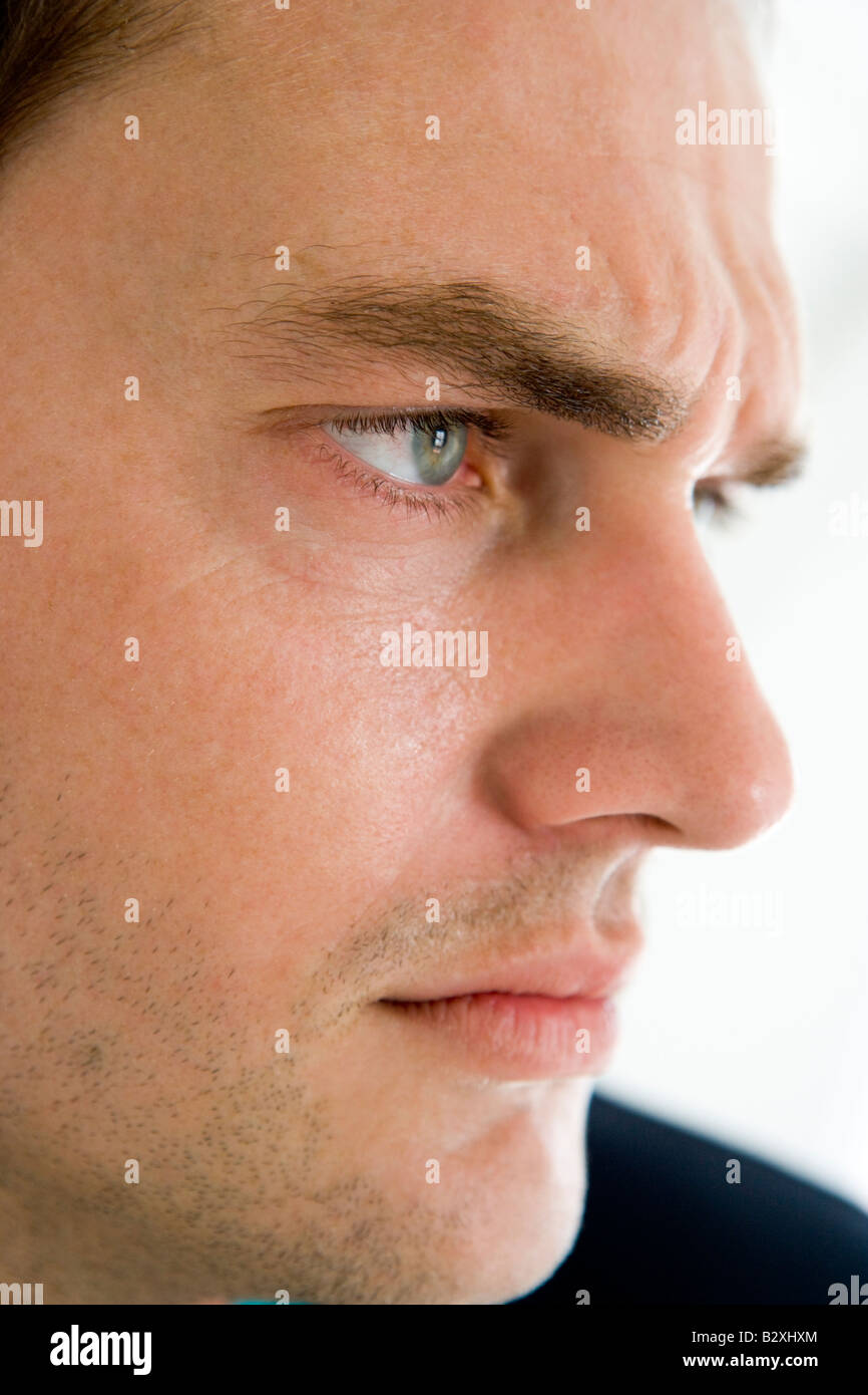 Head shot of man thinking Stock Photo - Alamy