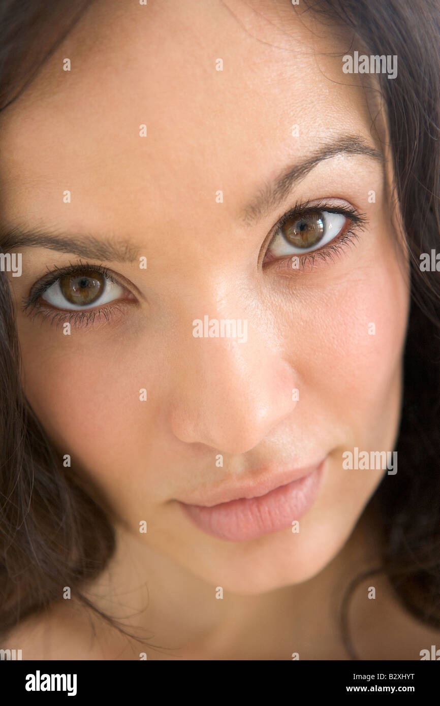Head shot of woman thinking Stock Photo - Alamy