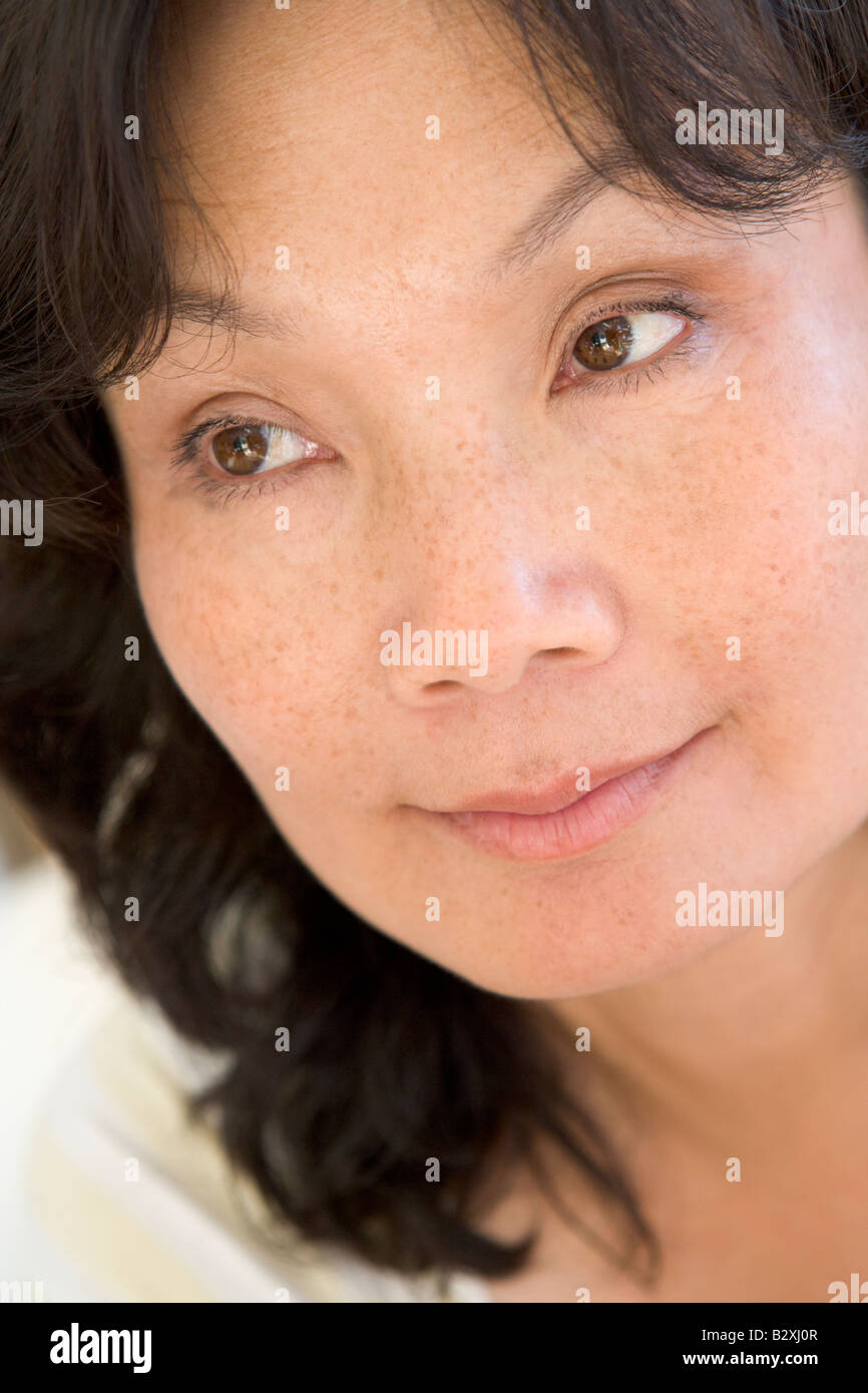 Head shot of woman thinking Stock Photo - Alamy