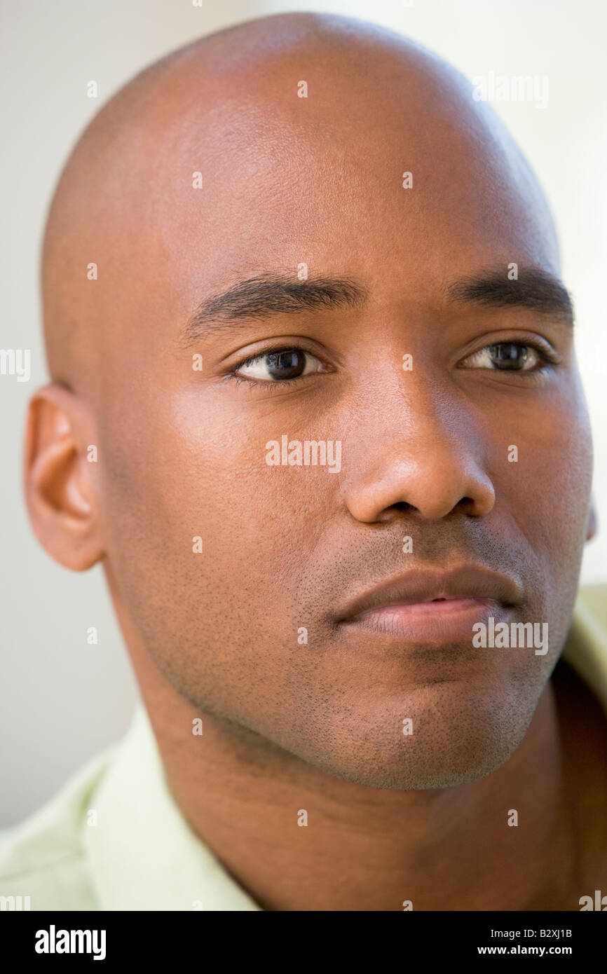 Head shot of man thinking Stock Photo - Alamy