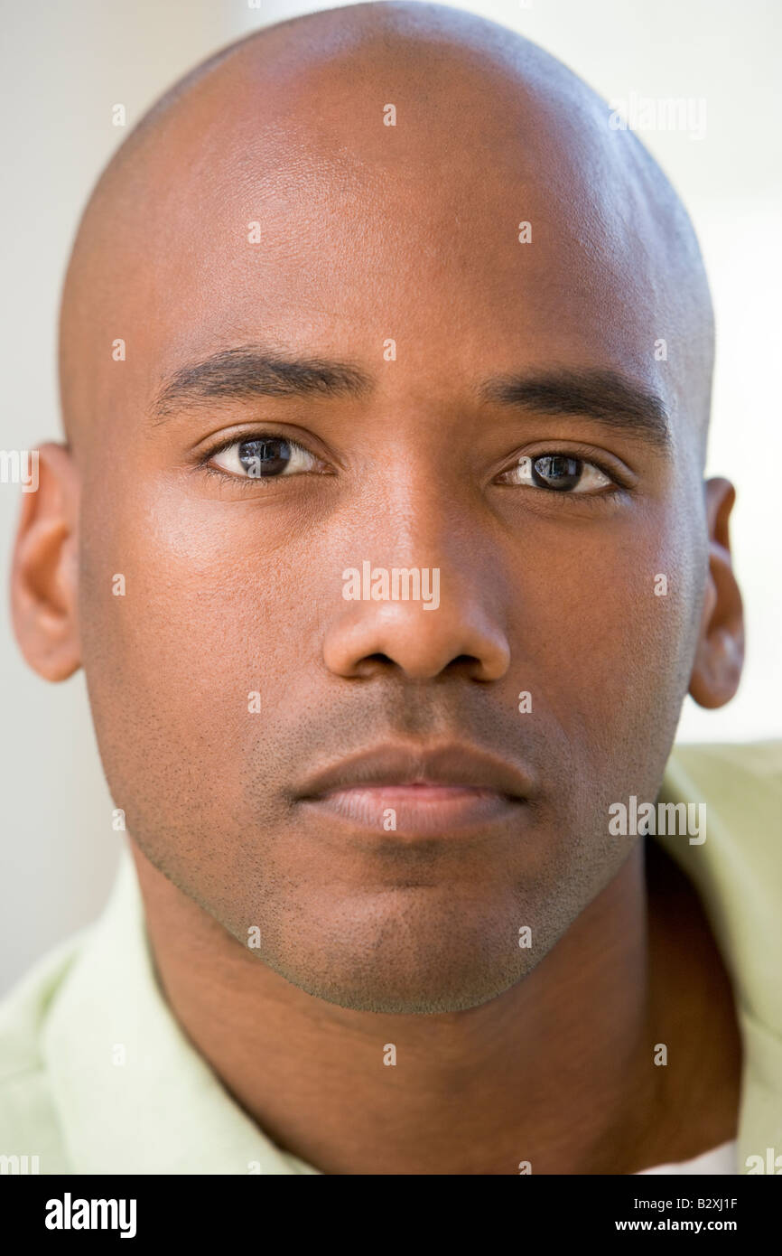 Head shot of man thinking Stock Photo - Alamy
