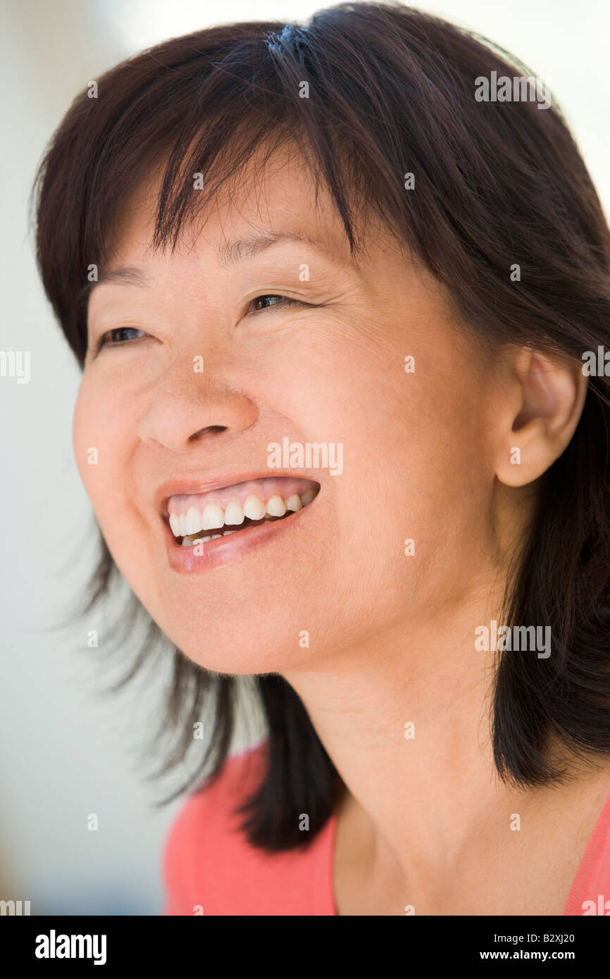 Head shot of woman smiling Stock Photo - Alamy