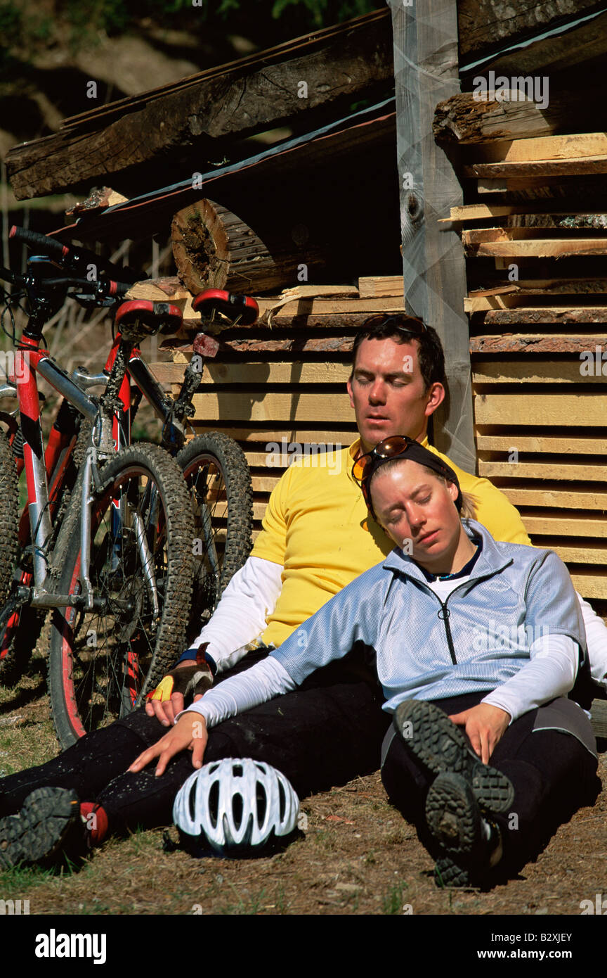 Cyclists resting after cycle ride Stock Photo - Alamy
