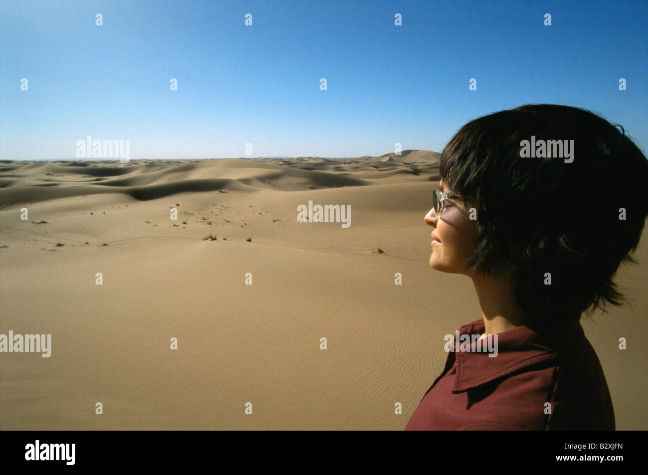 Woman standing desert dune looking view hi-res stock photography and ...