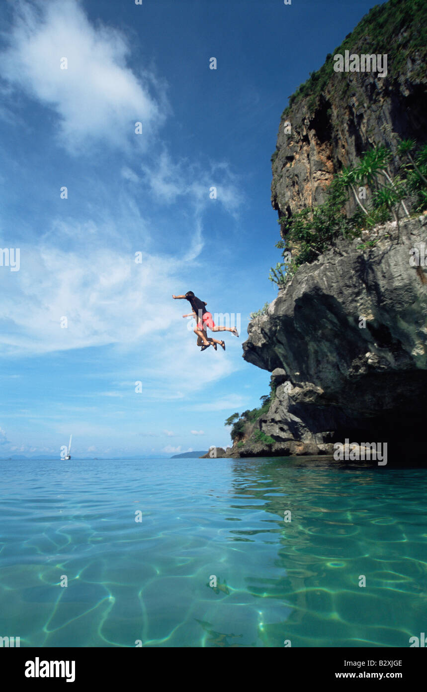 Man jumping off cliff sea hi-res stock photography and images - Alamy