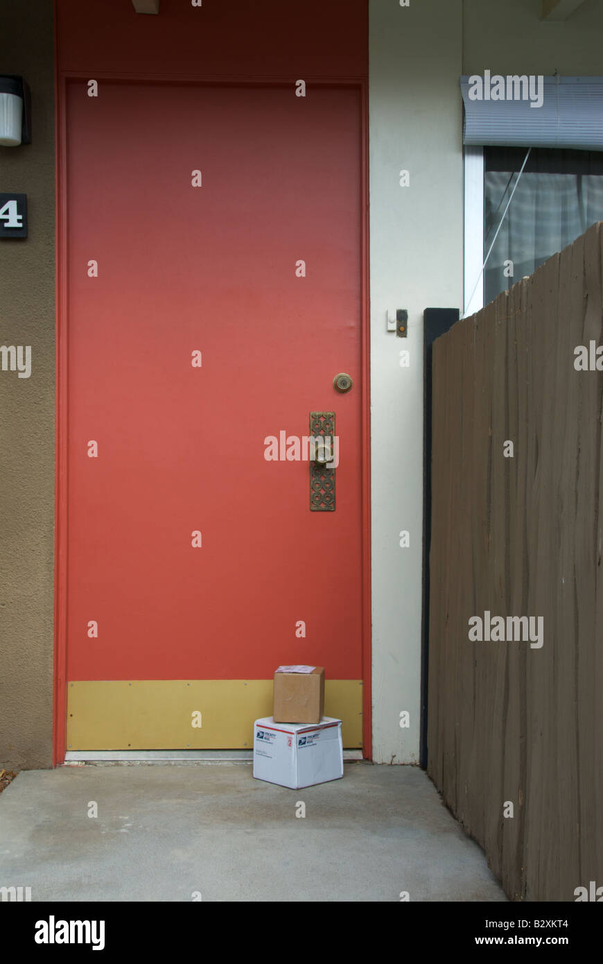 Parcels left at front door Stock Photo - Alamy