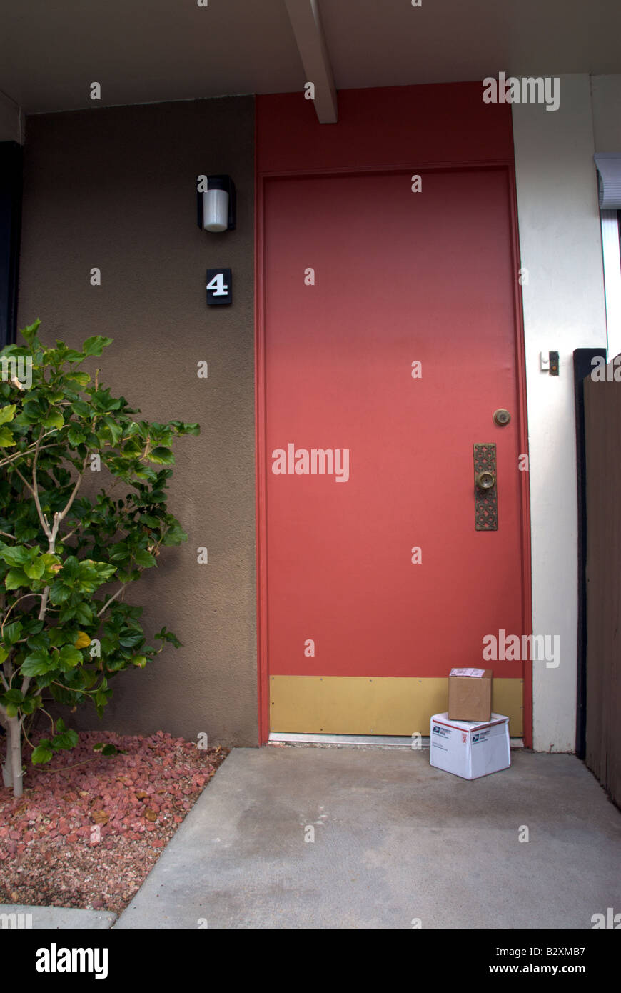 Parcels left at front door Stock Photo - Alamy