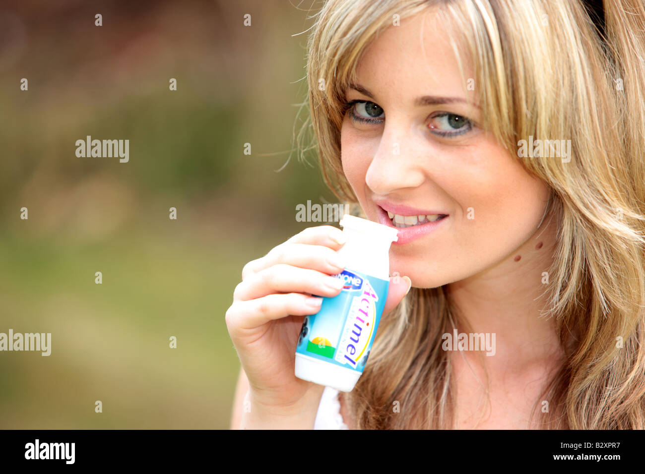 Young Woman Drinking Yogurt Drink Model Released Stock Photo - Alamy