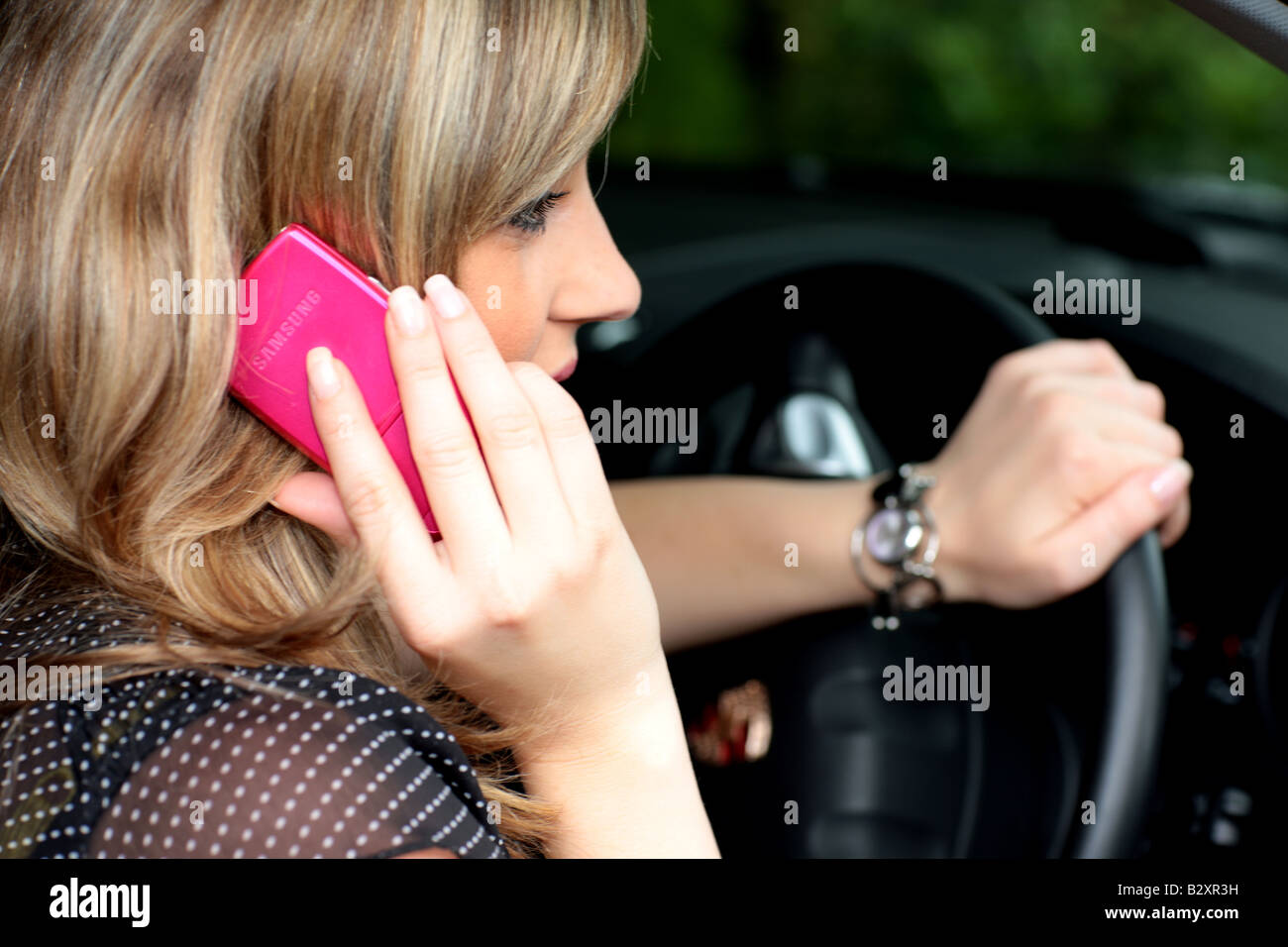 Young Woman Driving Using Mobile Telephone Model Released Stock Photo ...