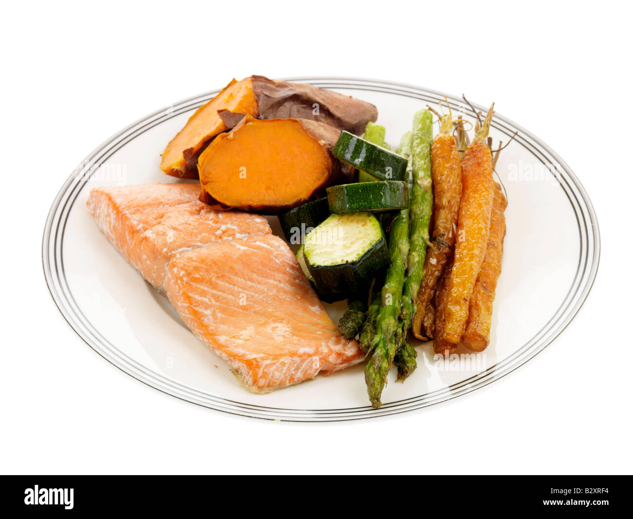 Baked fish roasted potatoes Cut Out Stock Images & Pictures - Alamy