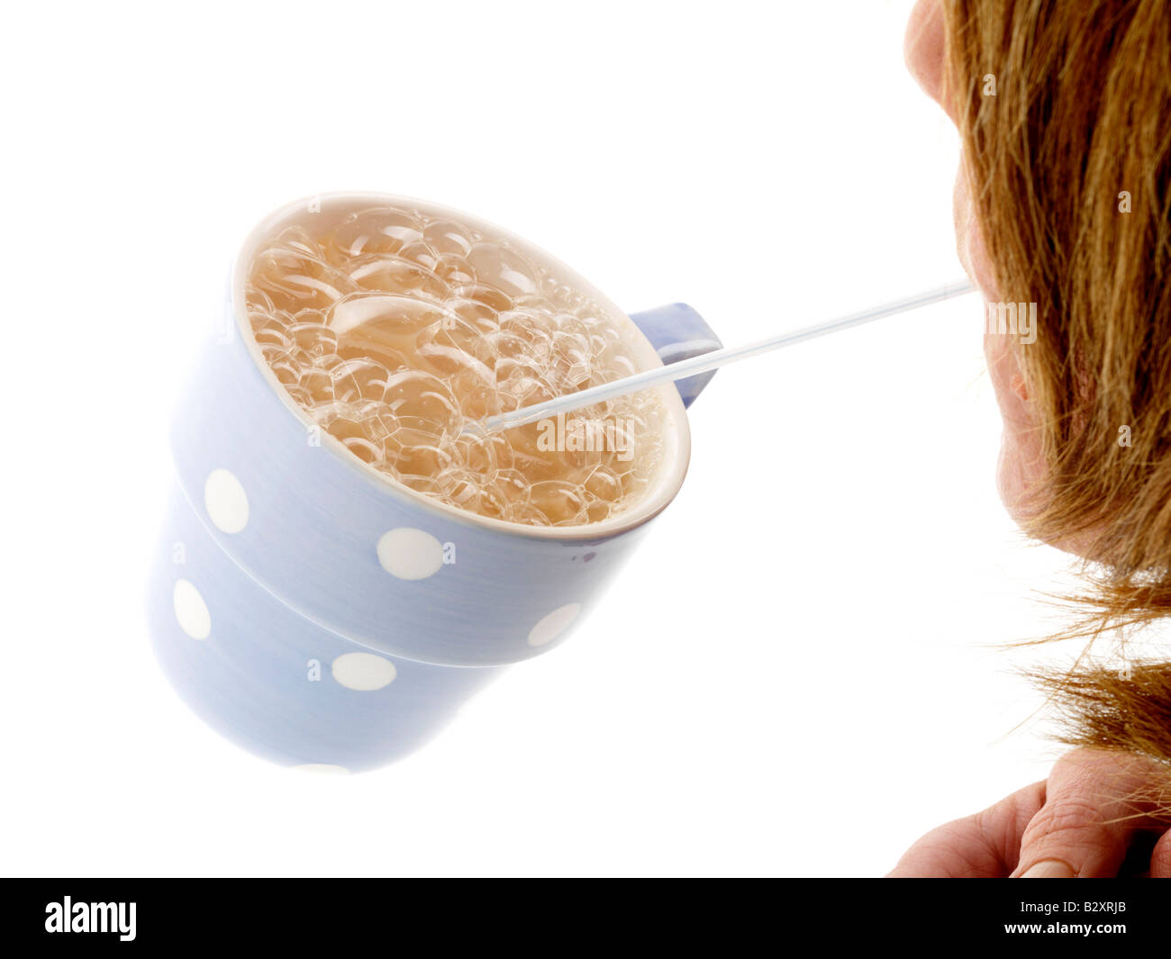Young Woman Blowing Bubbles in Tea Model Released Stock Photo - Alamy