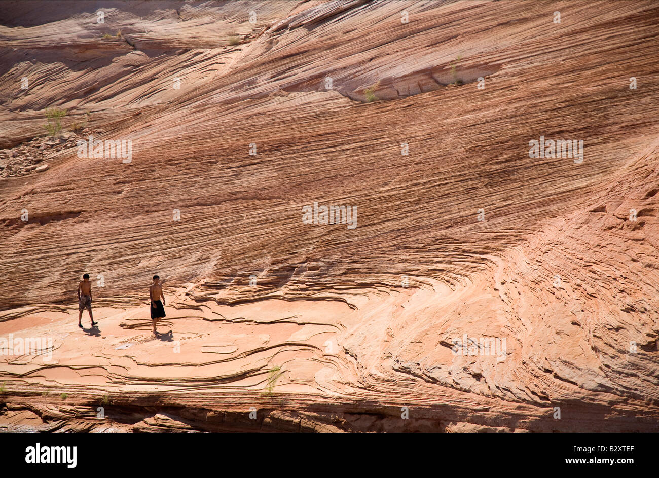 Two boys by the banks of Lake Powell 3 Stock Photo - Alamy