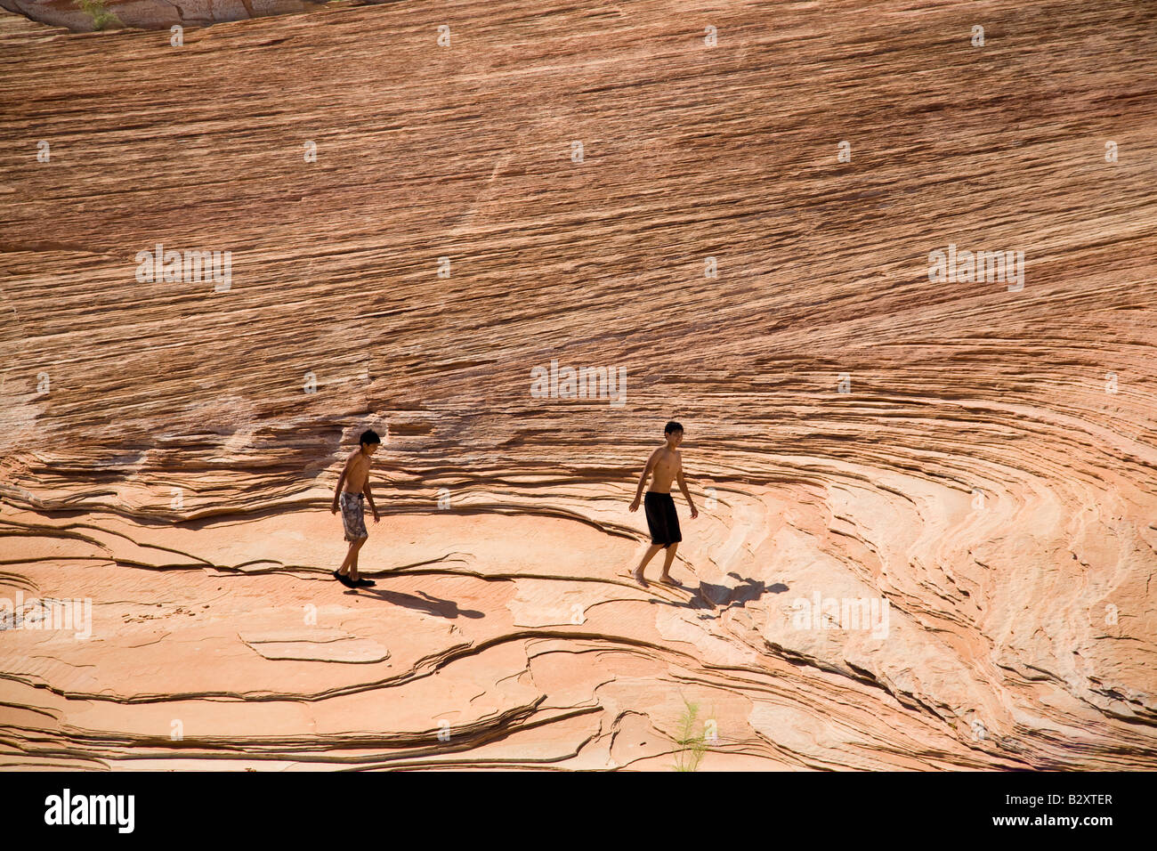 Two boys by the banks of Lake Powell 5 Stock Photo - Alamy